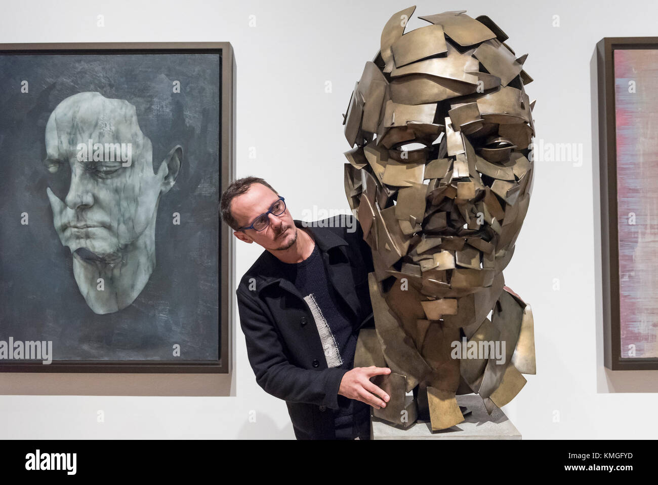 London, UK. 7 December 2017. Artist Jonathan Yeo stands between his ...