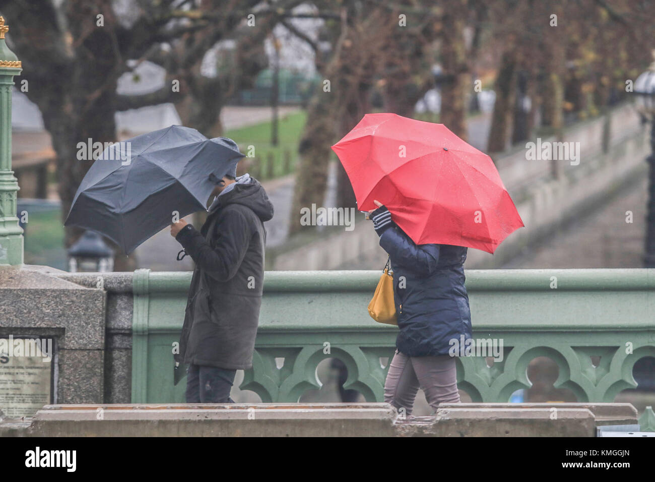 London UK. 7th December 2017. Pedestrians on Westminster are caught in ...