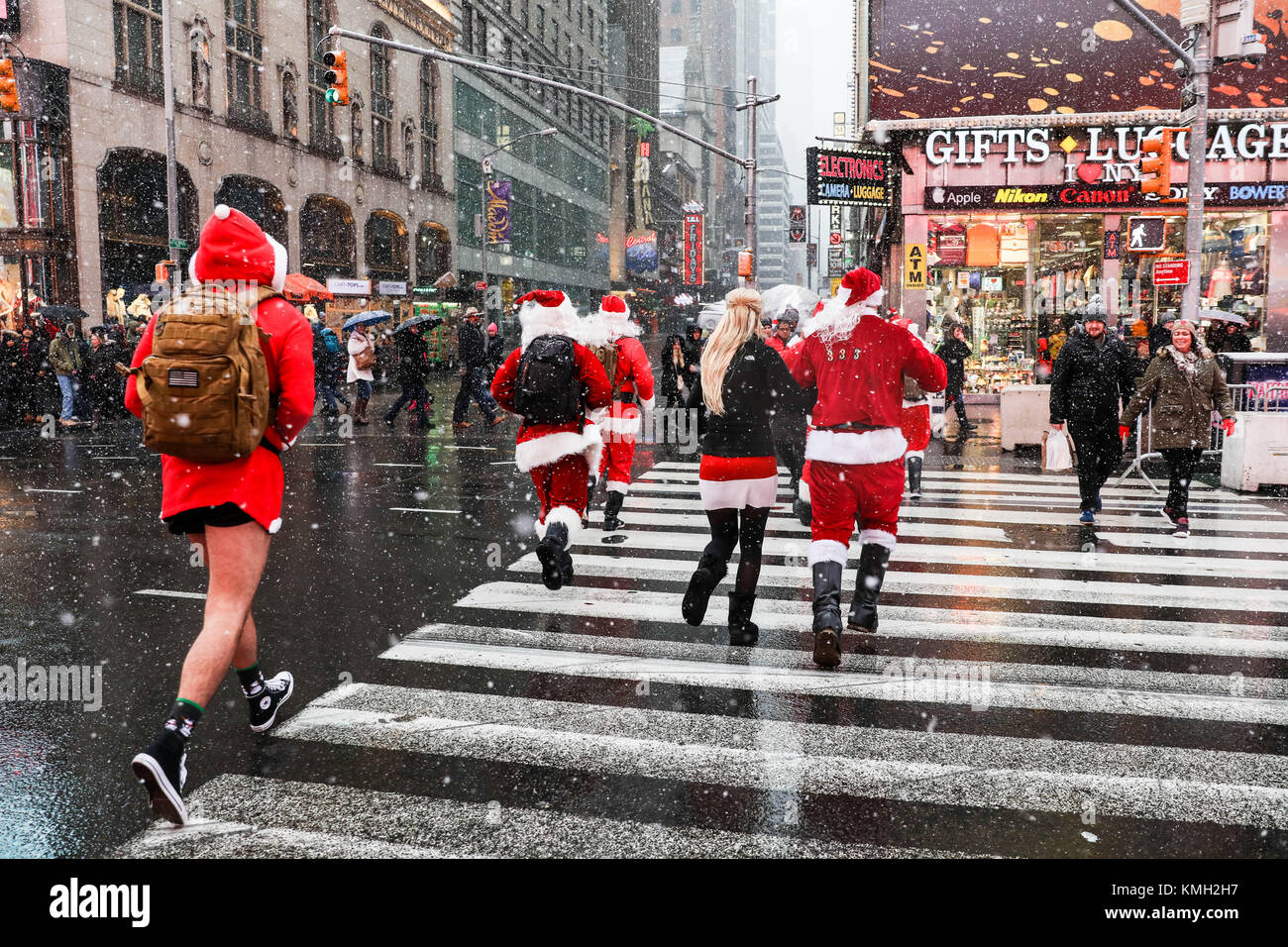 New York, USA. 9th December, 2017. SantaCon participants are seen in ...