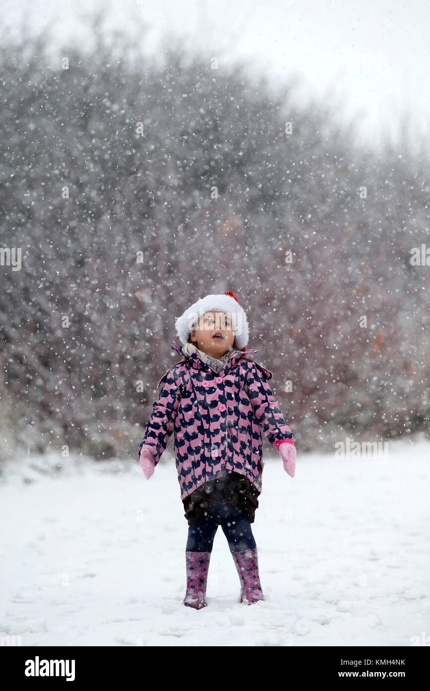 Cambridge, UK 10th December 2017. Ivy Mitchell, 2 has fun in the heavy ...