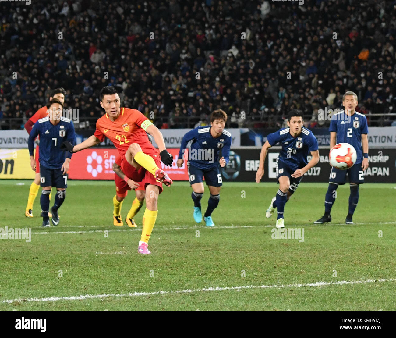 Tokyo, Japan. 12th Dec, 2017. China's Yu Dabao (front) shoots a penalty ...