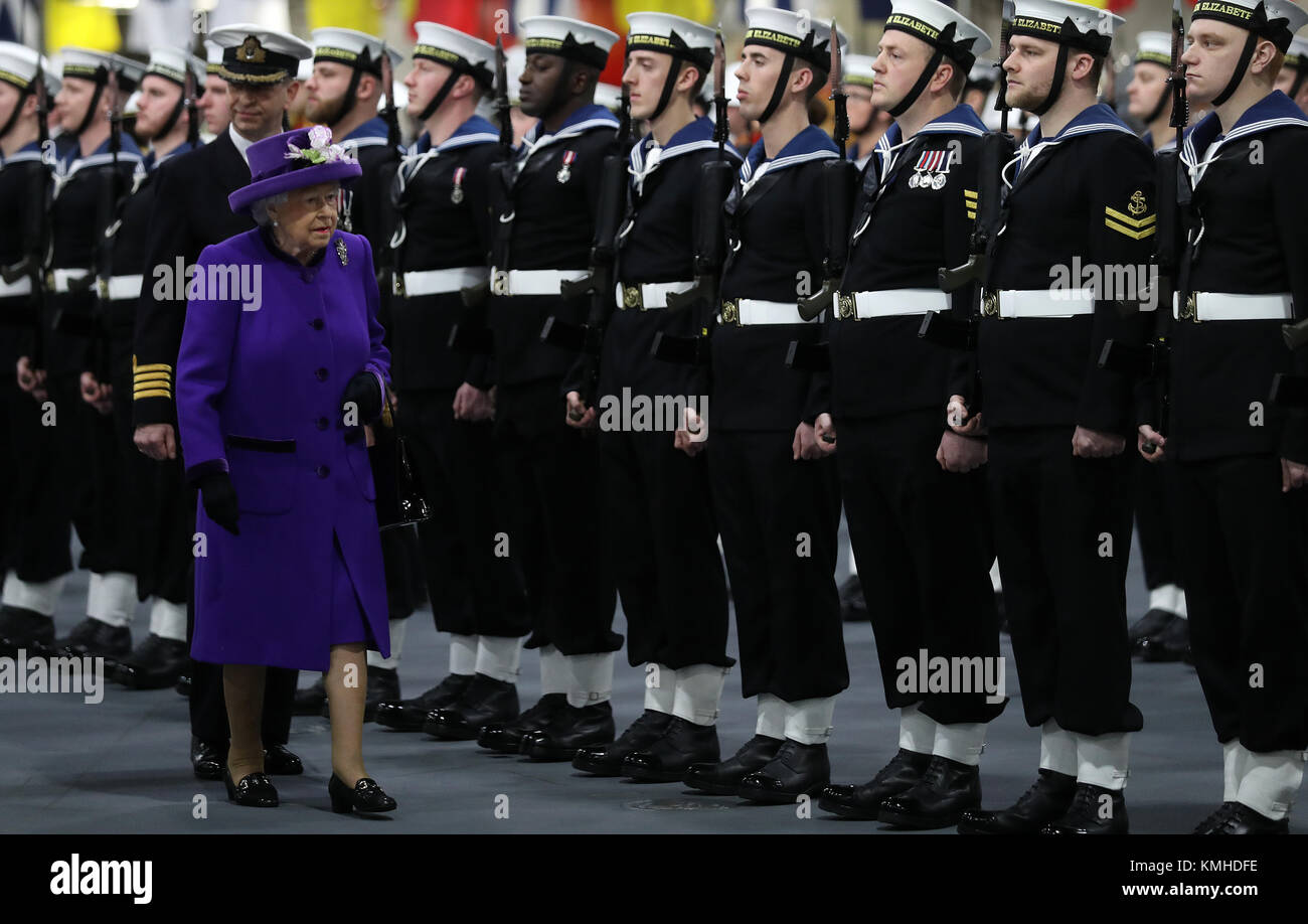 Queen Elizabeth II walks with the ship's commanding officer Captain ...