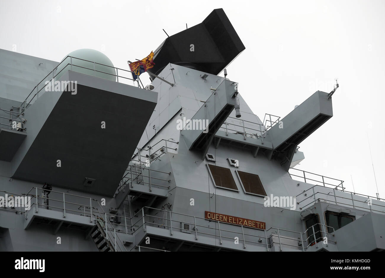 The Royal Standard flag flies above the forward tower on HMS Queen ...