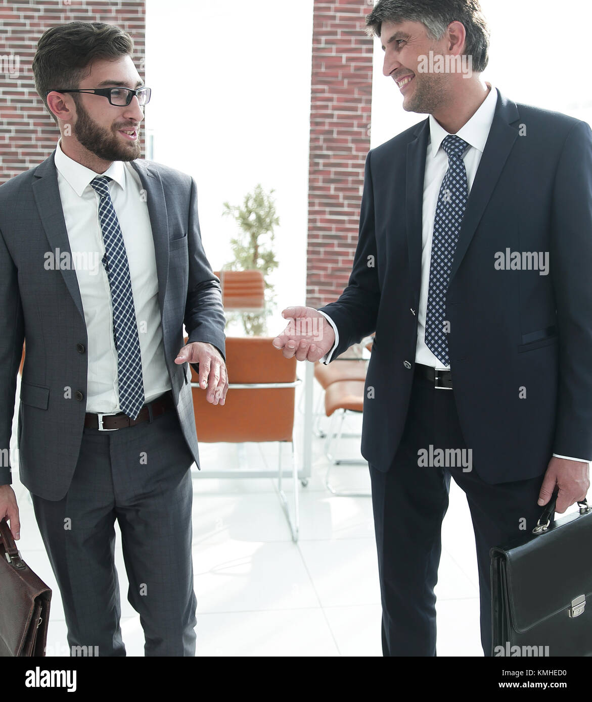 Two company employees discuss business issues Stock Photo - Alamy