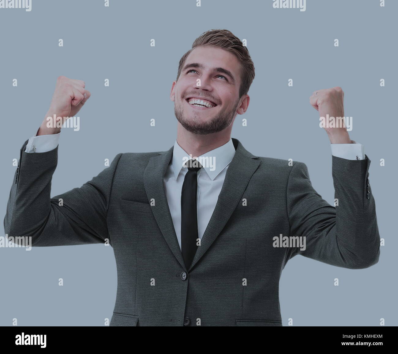 Excited smile business man raised arms, isolated over white background ...