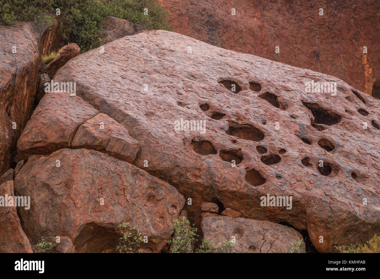 Uluru (Ayers Rock) in the rain during a rare rainstorm in Uluru Kata ...