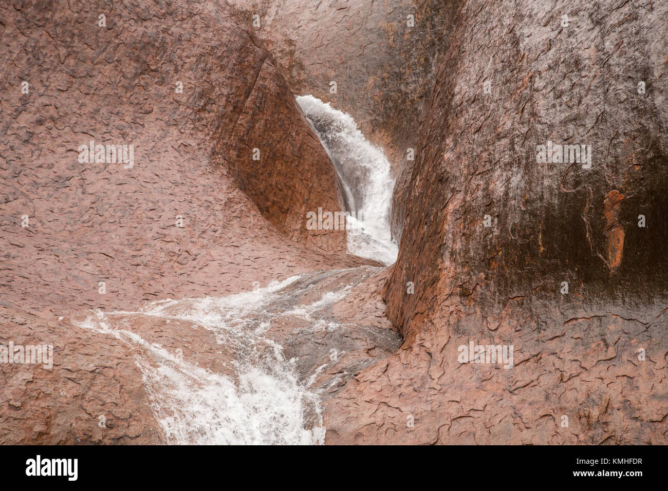 Ayers Rock in the rain - waterfalls on Uluru during a rare rainstorm in ...