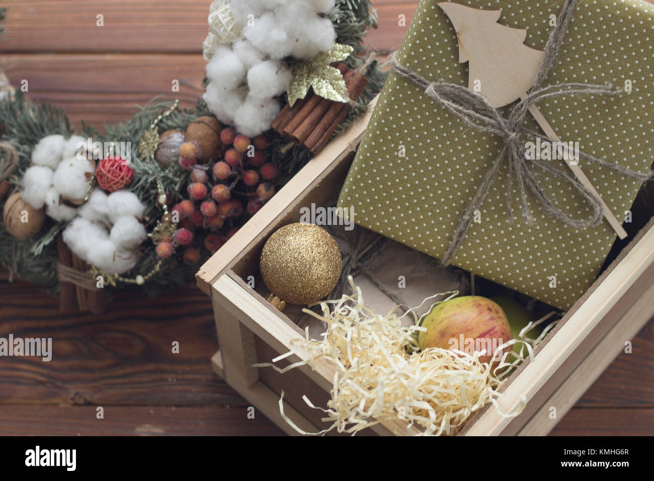 A festive still life with a big box and a wreath Stock Photo - Alamy