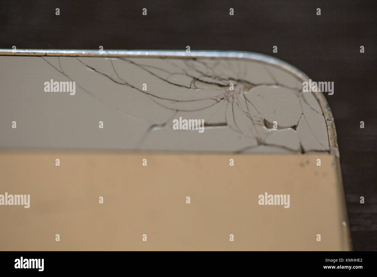 Apple iPhone 6 damaged with a broken screen and a hole in the corner ...