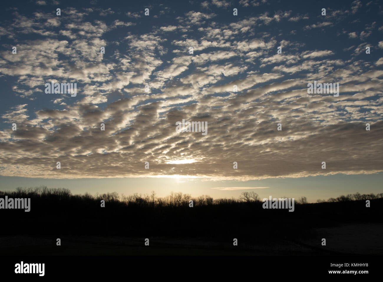 Clouds Over a Field During Sunrise Stock Photo - Alamy
