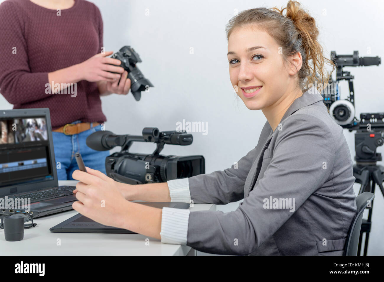 two young women video editor working with a laptop Stock Photo - Alamy