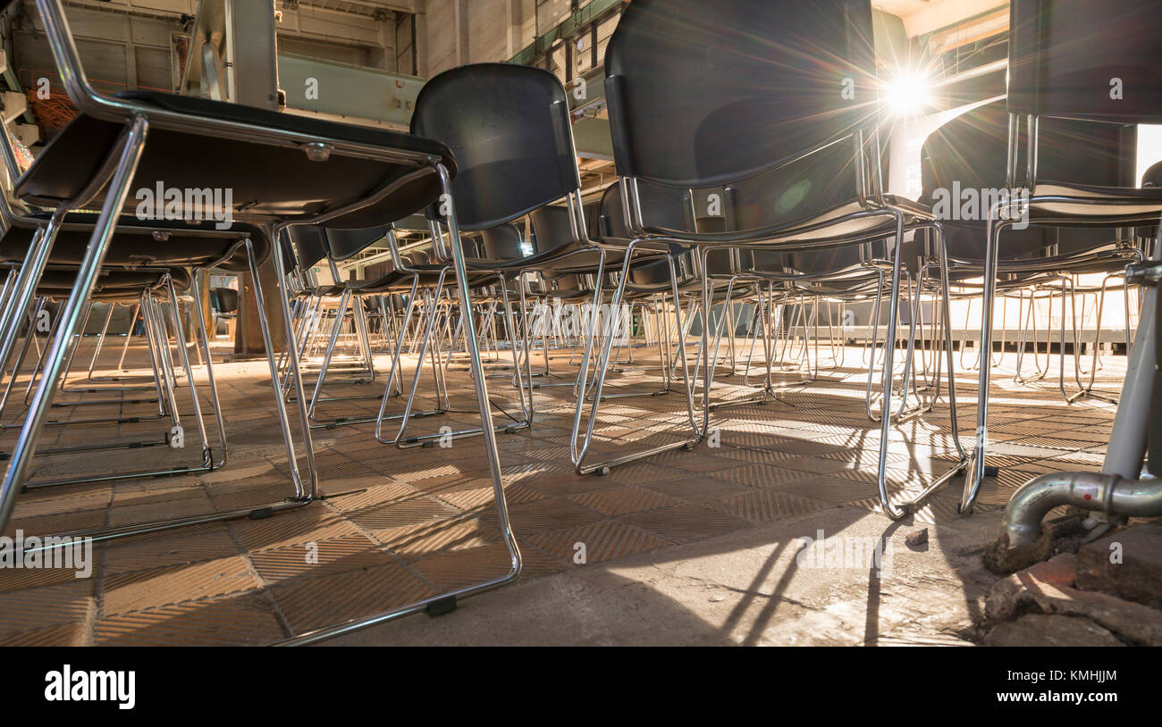 empty chairs at a workshop with backlit Stock Photo - Alamy