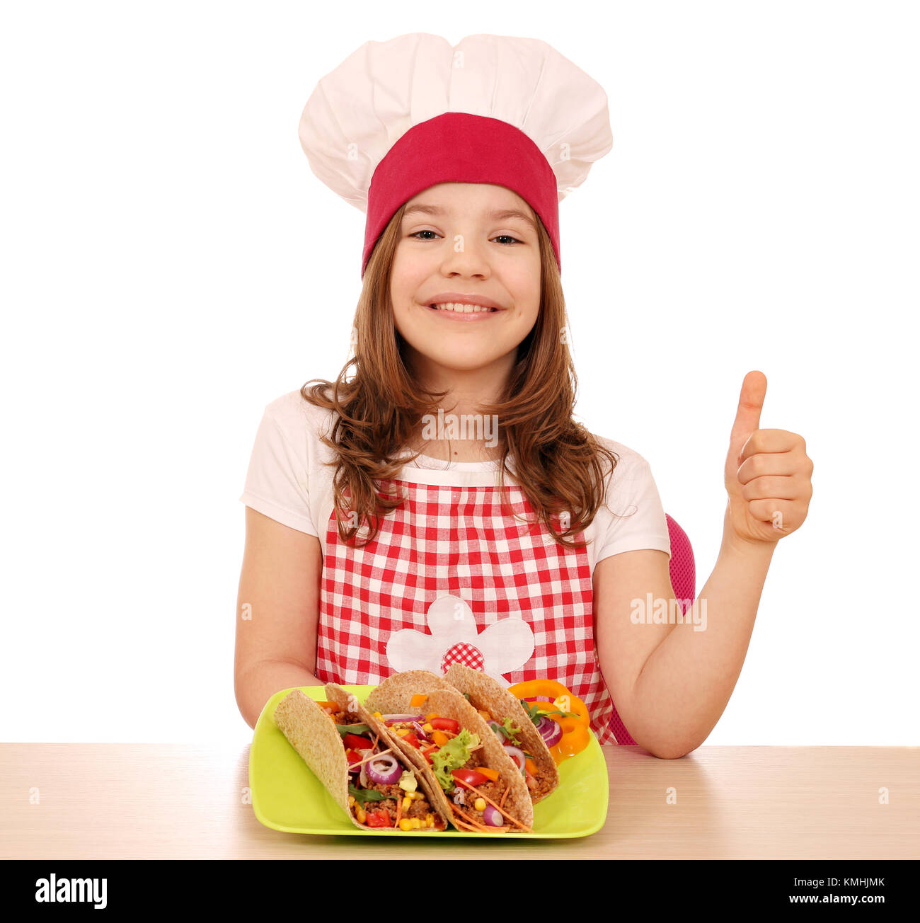 Happy little girl cook with tacos and thumb up Stock Photo - Alamy