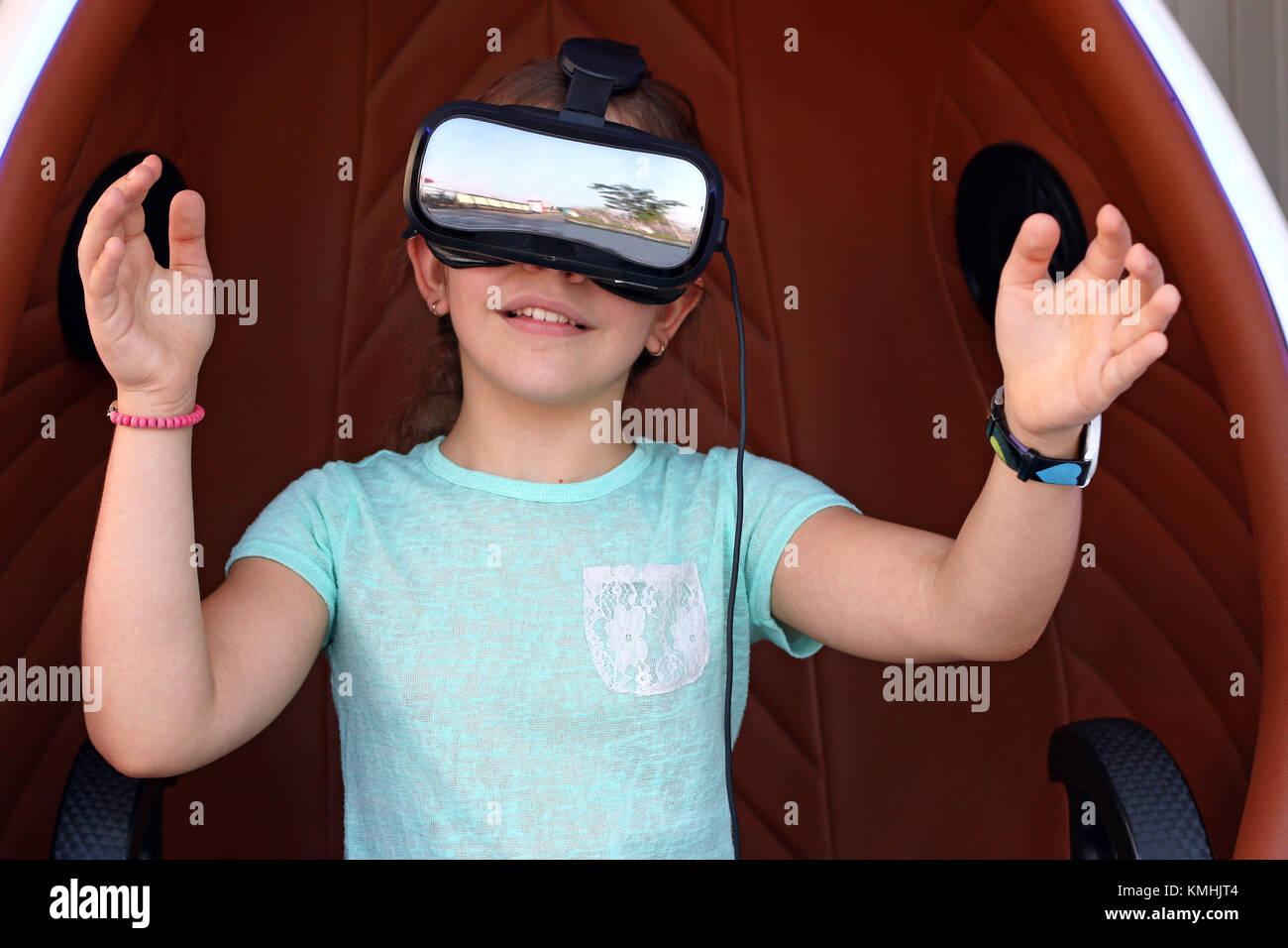 happy little girl with virtual reality headset on head Stock Photo - Alamy