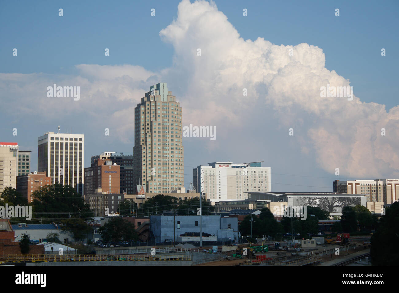 Raleigh, North Carolina skyline with blue sky and billowing clouds in ...