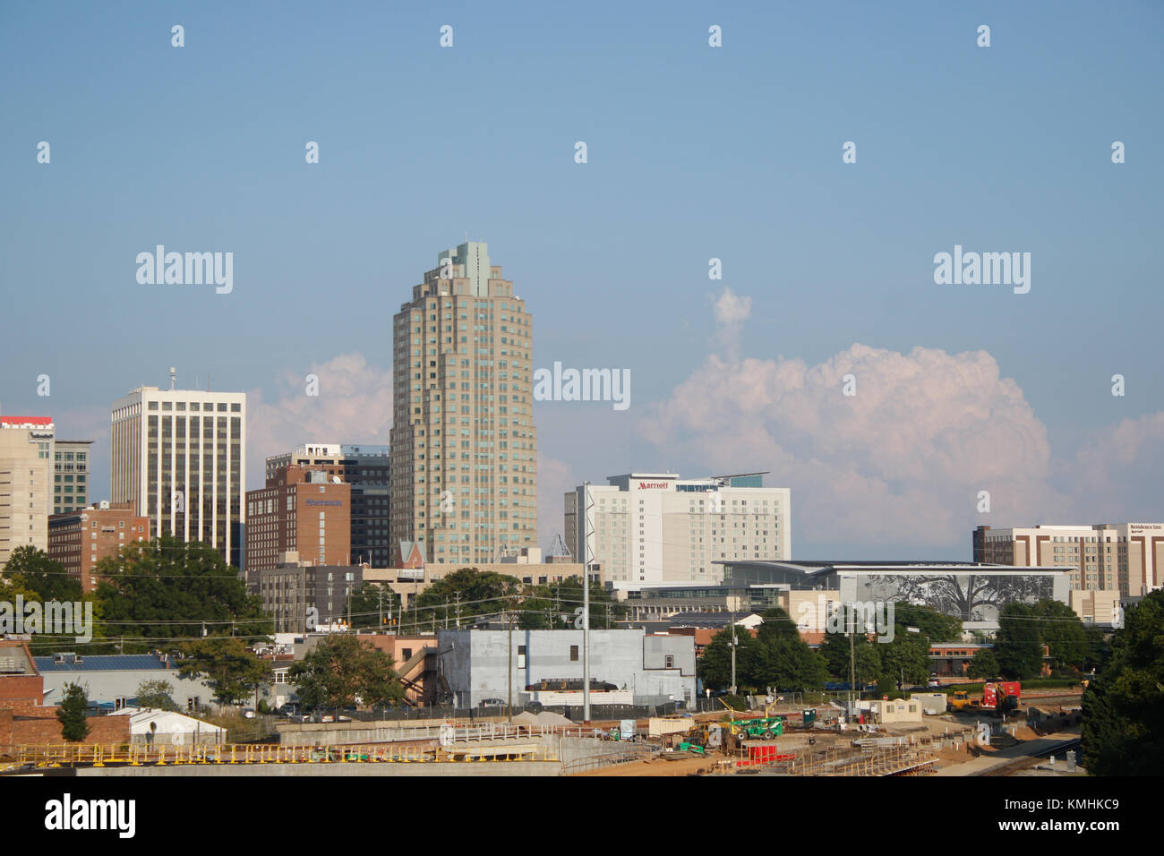 Raleigh, North Carolina skyline on a day with blue sky and fluffy ...