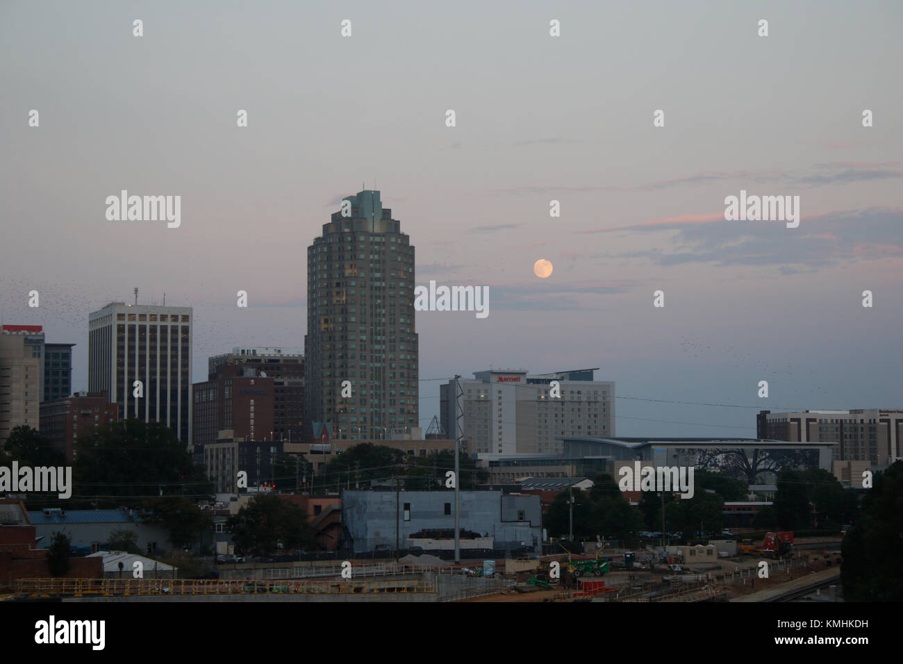 Full moon rising over the Raleigh, North Carolina skyline at dusk Stock ...