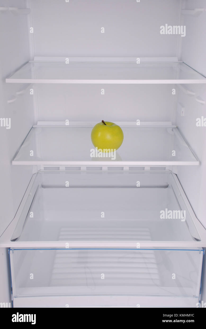 One apple in open empty refrigerator. Weight loss diet concept Stock ...