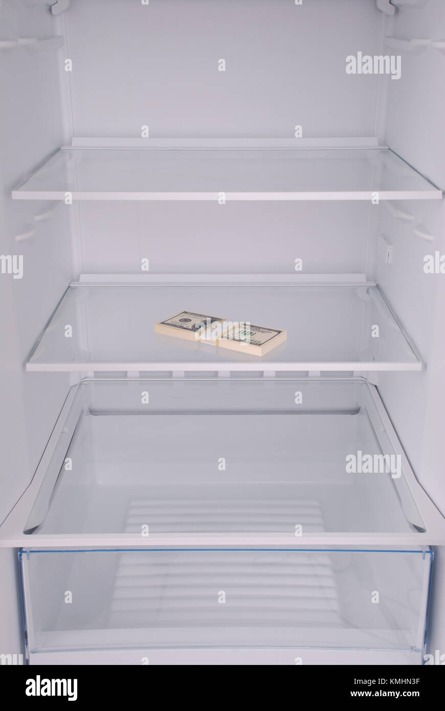Dollars inside in empty clean refrigerator with opened door Stock Photo ...