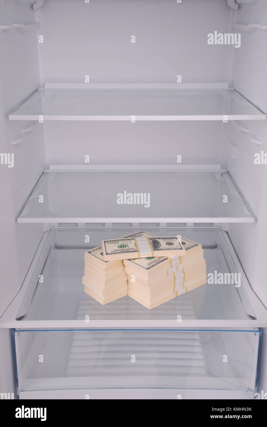 Dollars inside in empty clean refrigerator with opened door Stock Photo ...