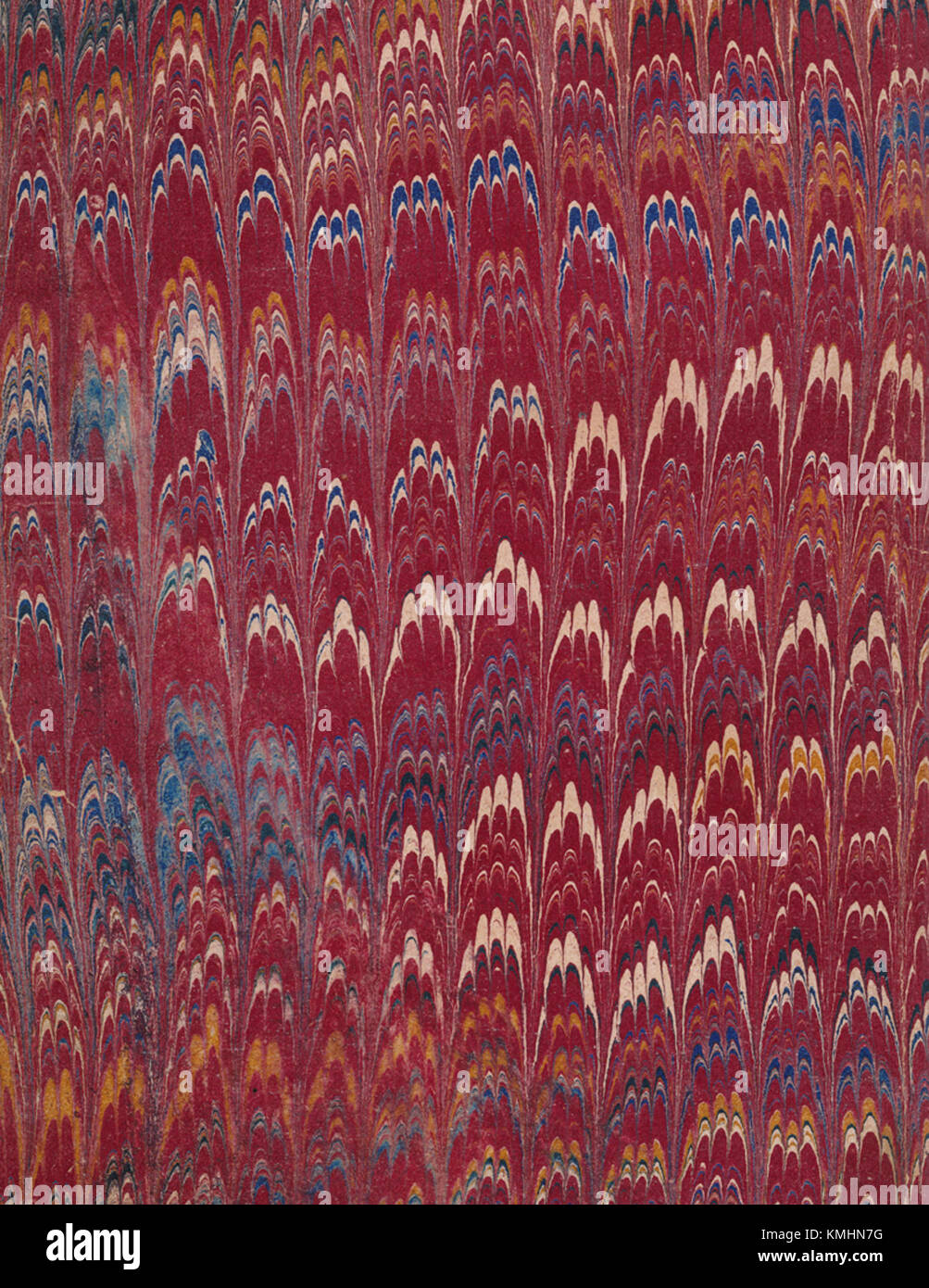 A decorative technique of marbling used on book boards, showcasing the ...