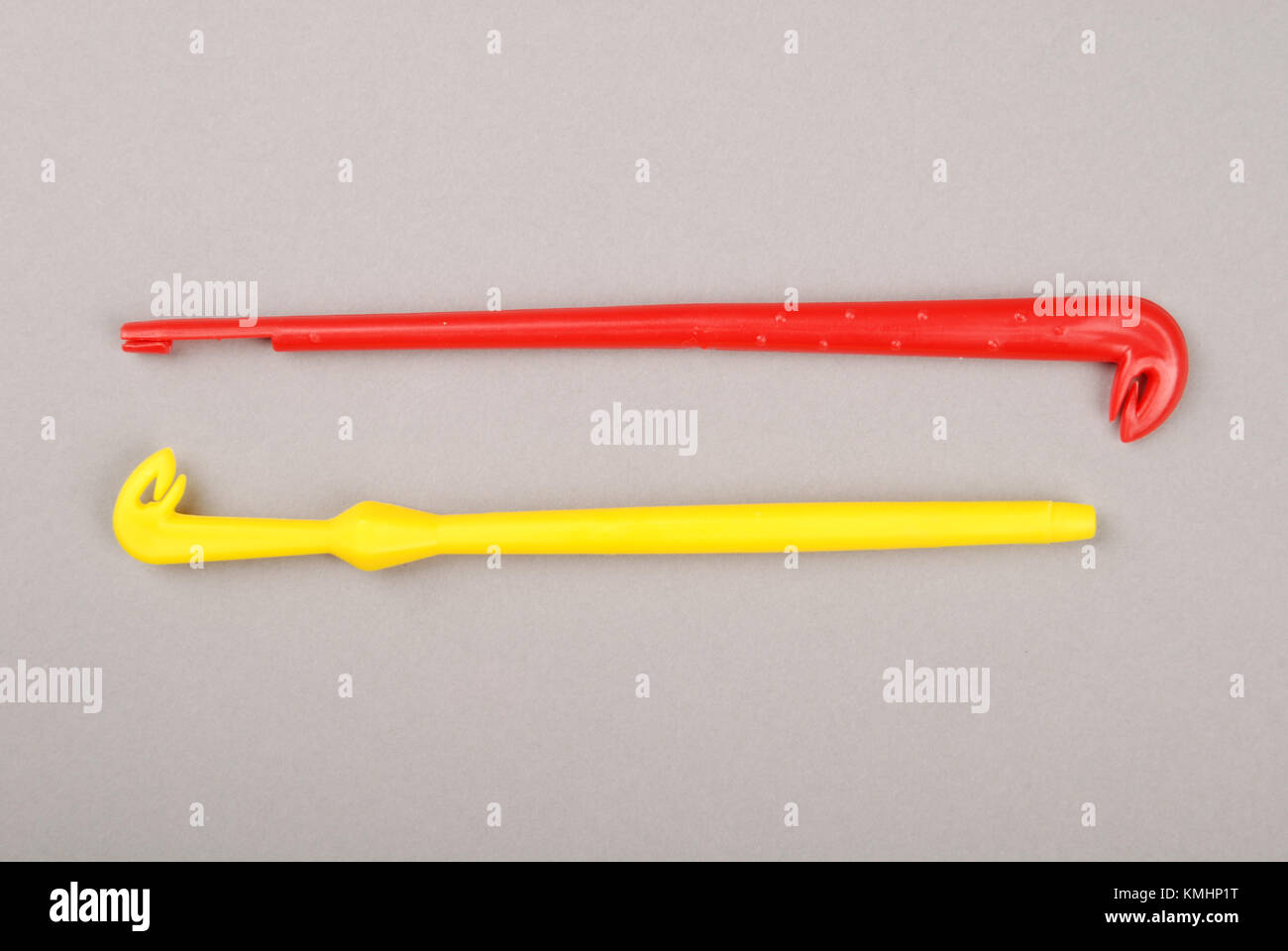 Red and yellow loop tier isolated on gray background Stock Photo - Alamy