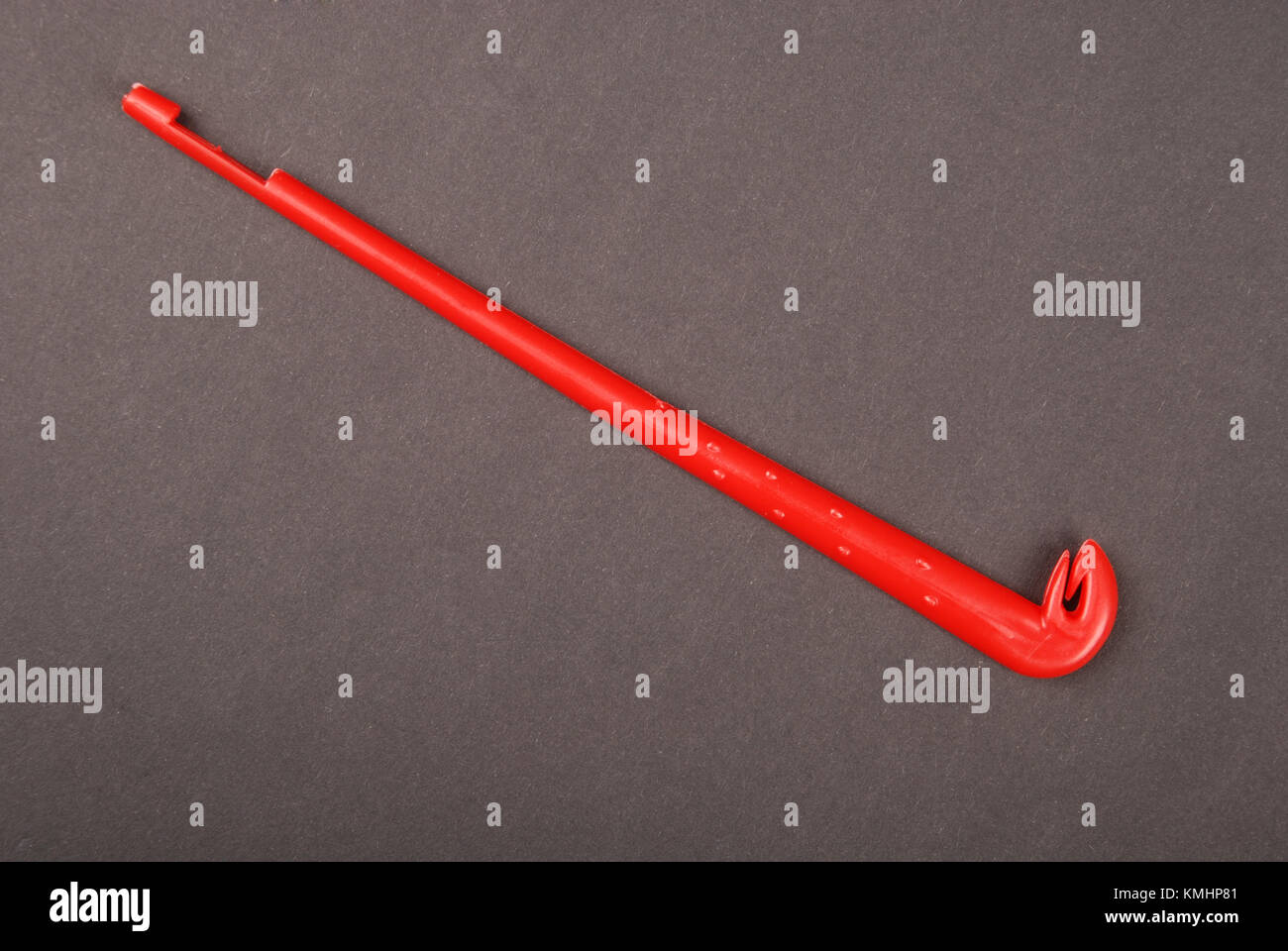 One red loop tier isolated on black background Stock Photo - Alamy
