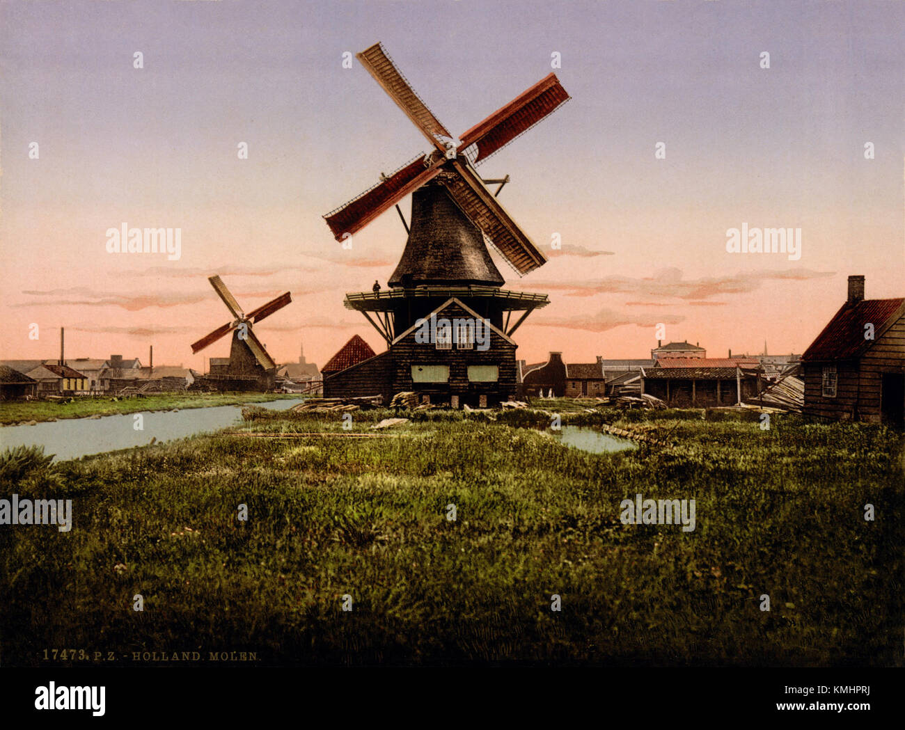 This image features Dutch windmills in Holland around 1905, capturing a ...