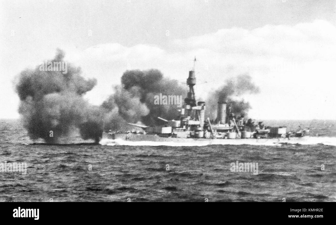 A Sweden-built ship of the Sverige class is depicted firing its guns ...