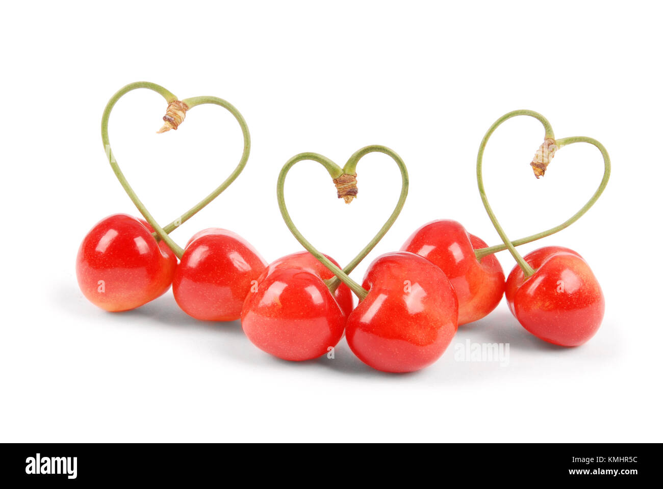 Pair of sweet cherry fruits with heart shaped stem isolated on white ...