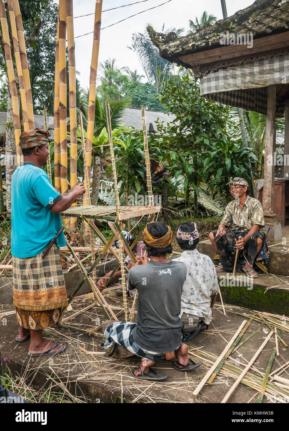 Men making biers to carry coffins at a traditional, communal cremation ...