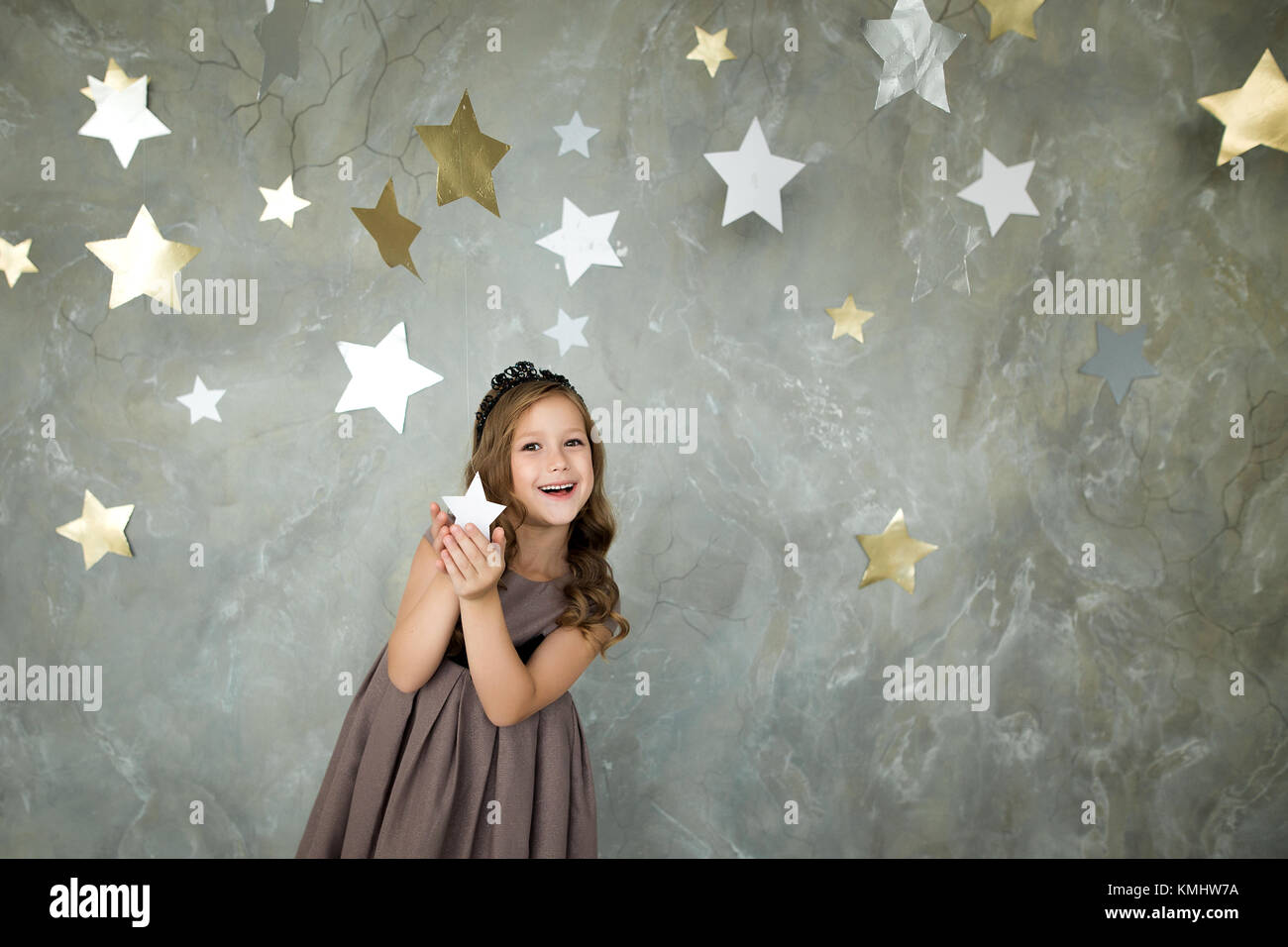 portrait of a happy little girl on a background of stars Stock Photo ...