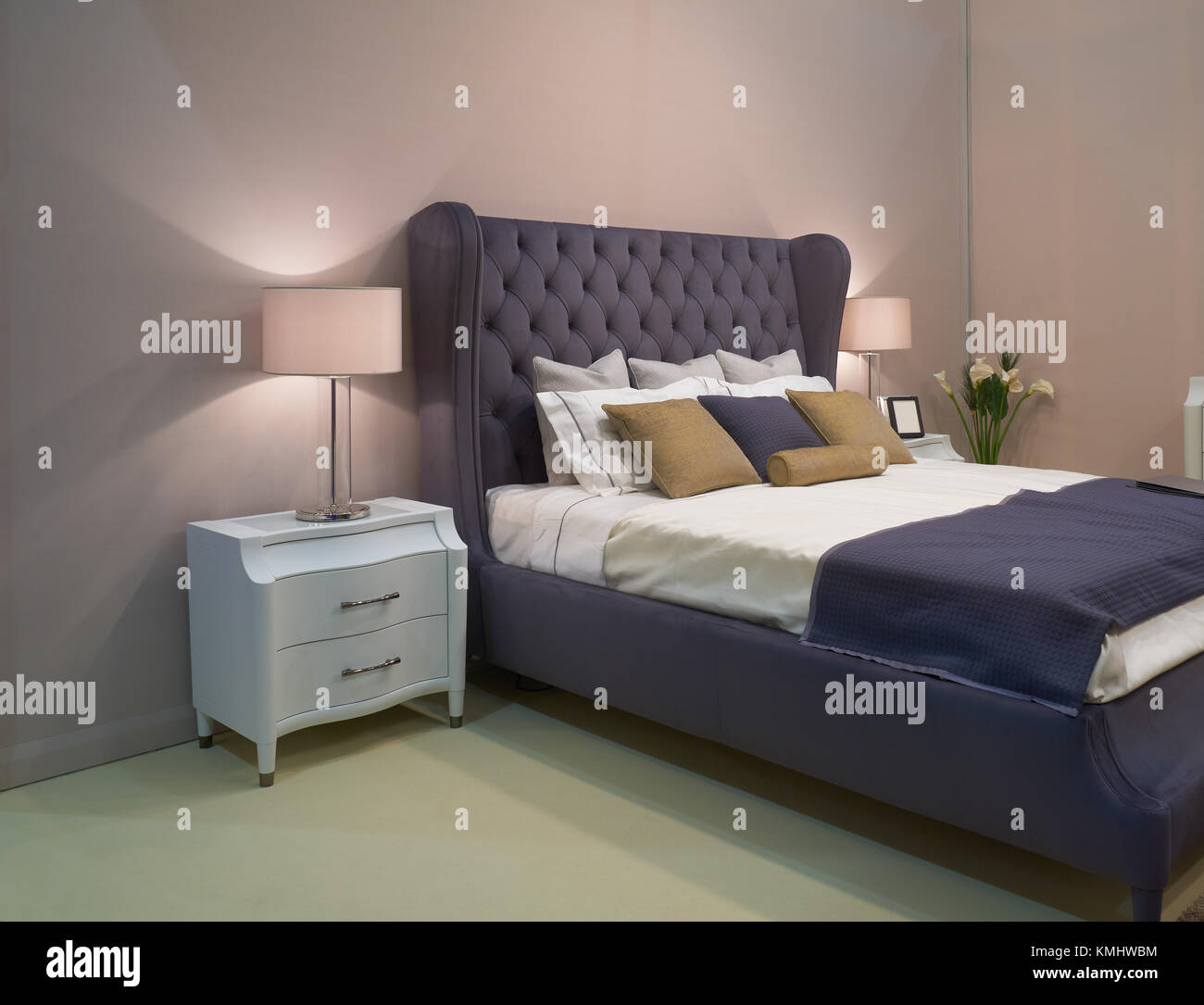 New comfortable double bed with eight pillows on it in the bedroom ...