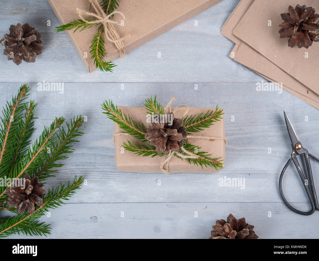 Christmas holiday handmade present in craft paper. Spruce branches and ...