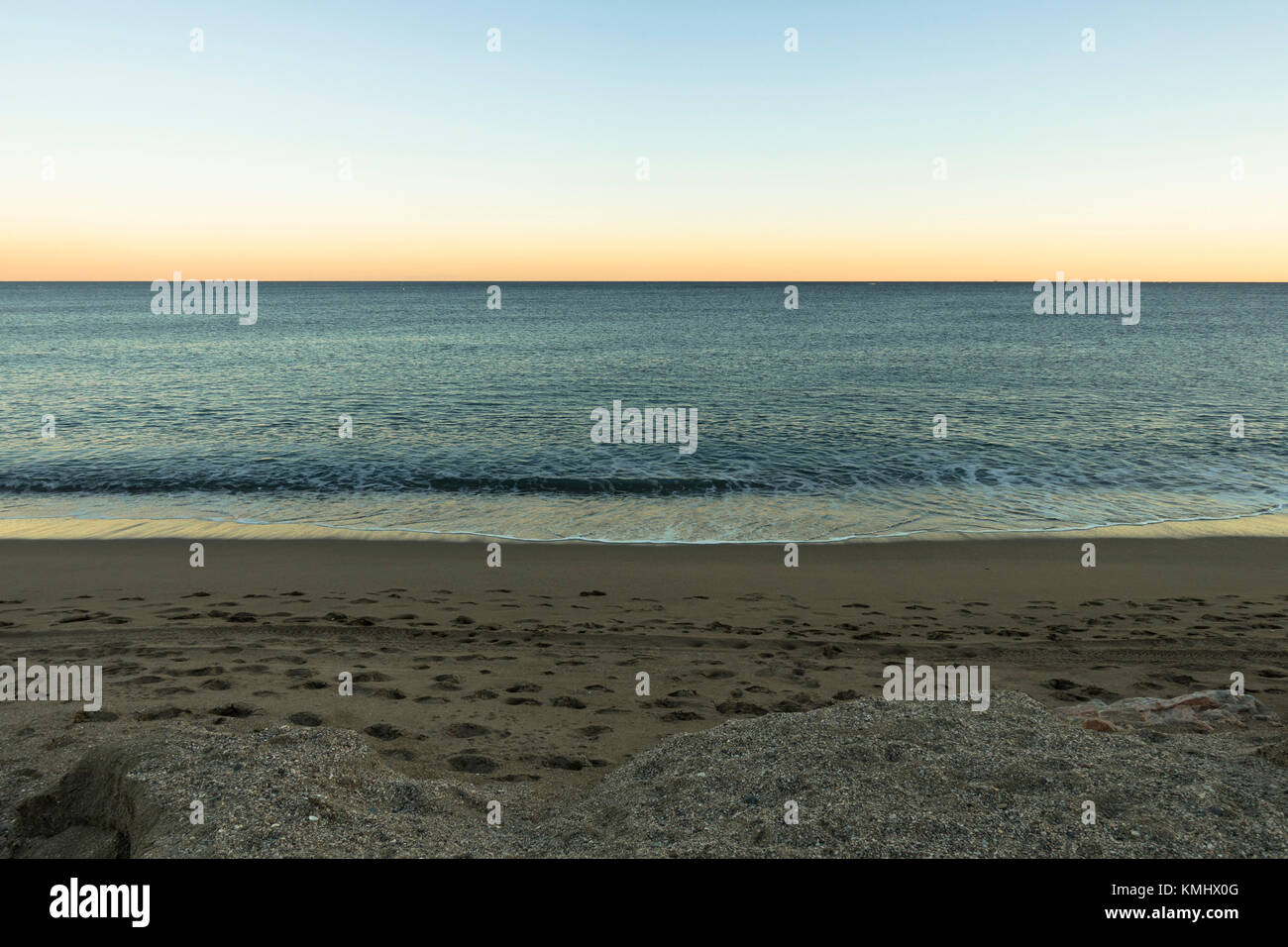 Empty beach scene at sunset, Spain Stock Photo - Alamy