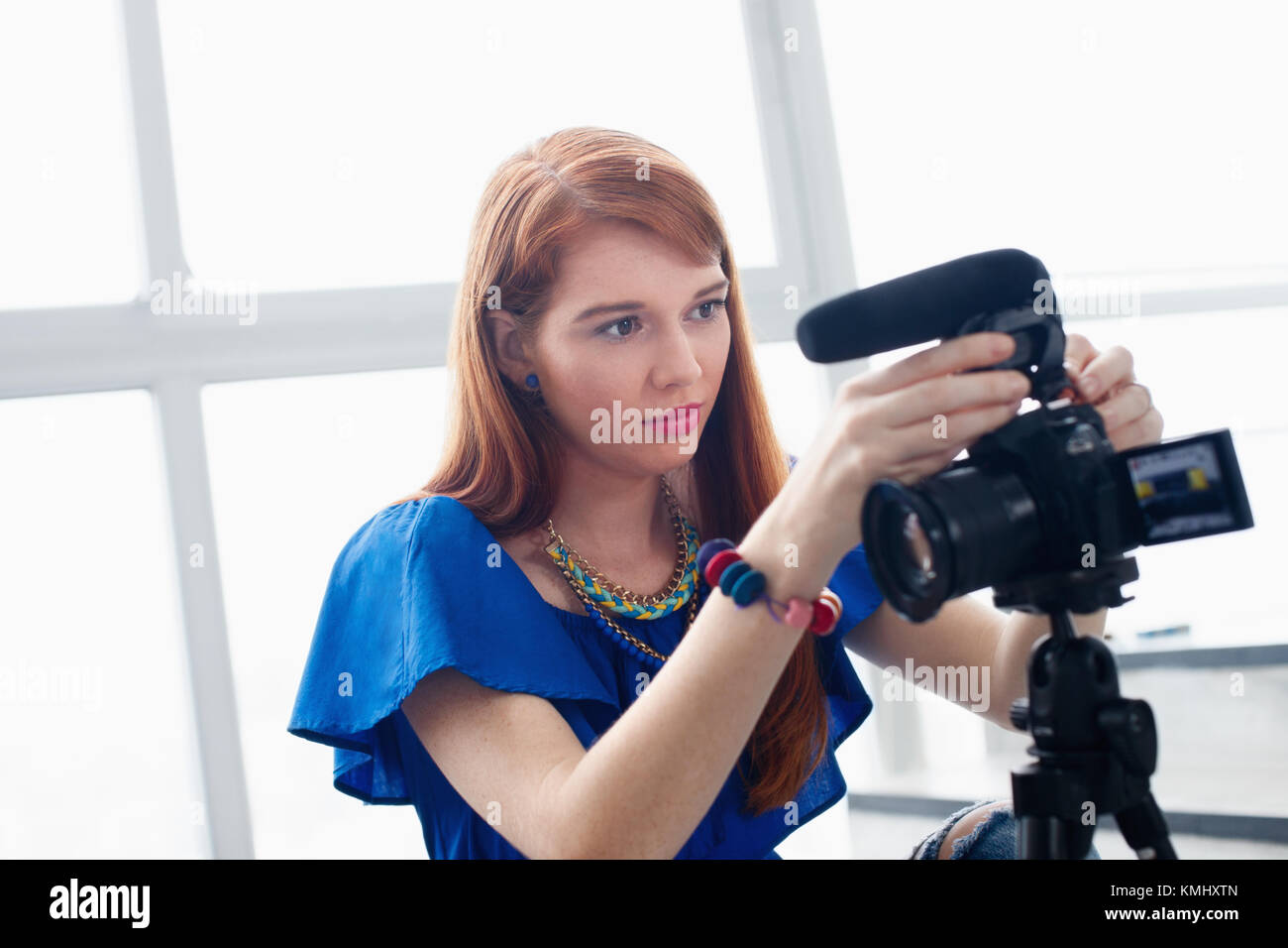 Woman Recording Vlog Video Blog Using DSLR Camera Stock Photo - Alamy