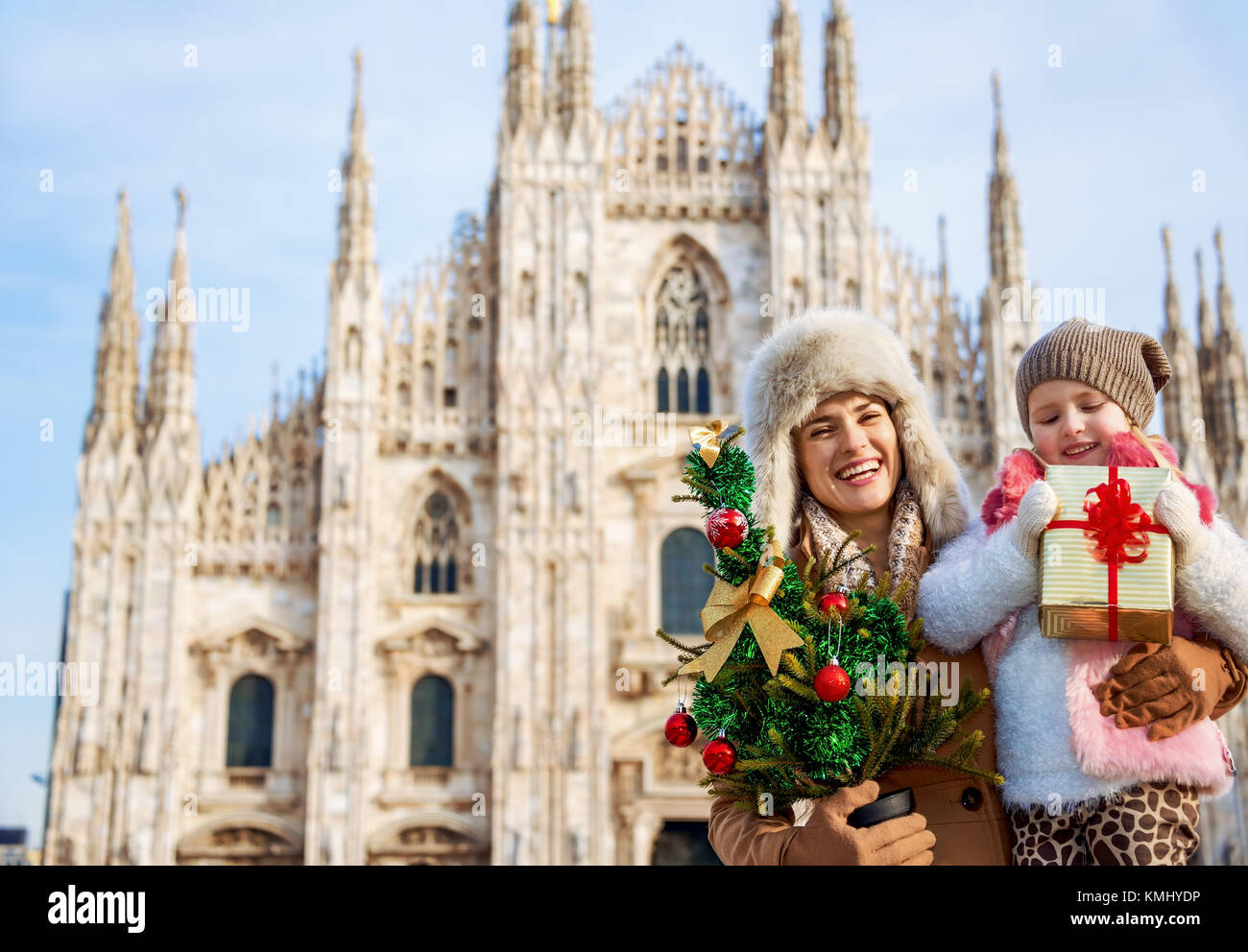 Fun Christmas family trip to Milan, Italy. smiling modern mother and ...