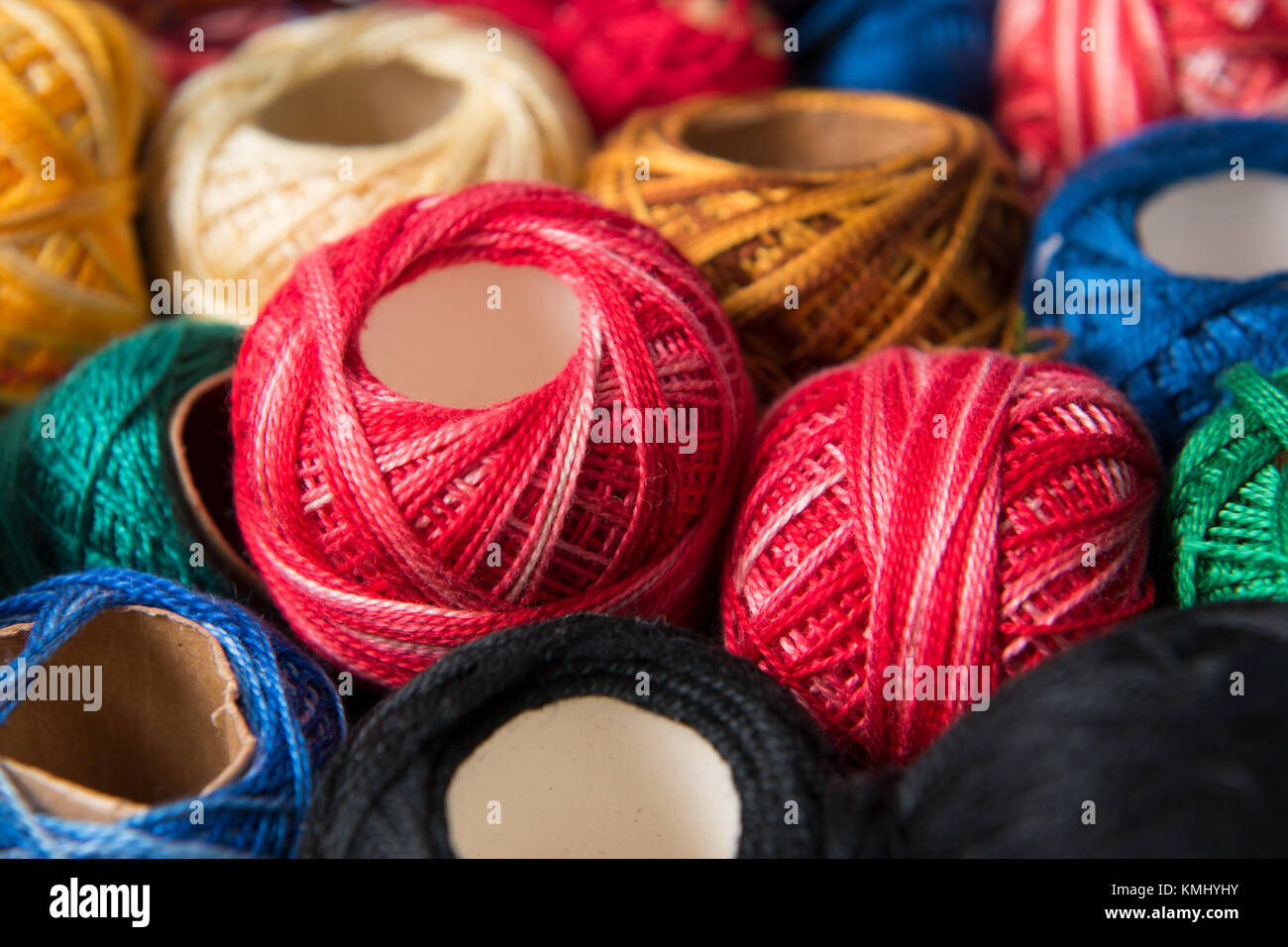 Group of sewing threads as background or wallpaper, yellow sewing ...