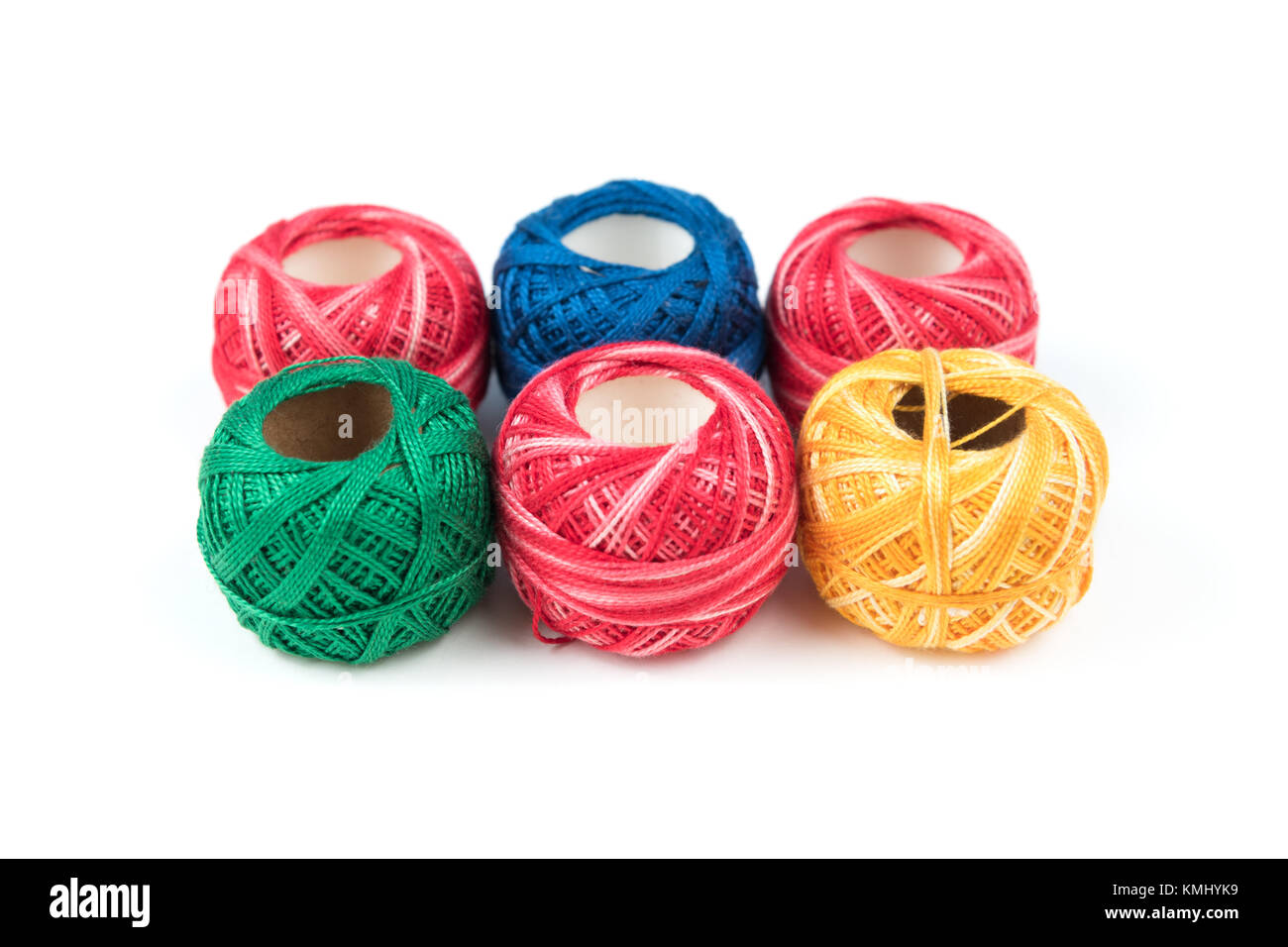 Set of six colored sewing threads on a white background Stock Photo - Alamy