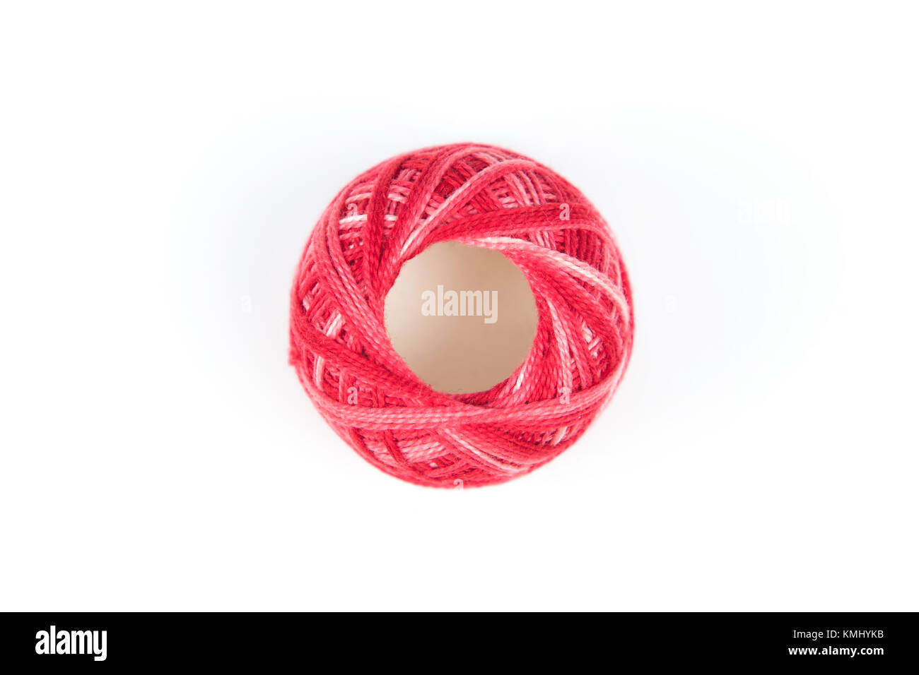 Red sewing thread on a white background Stock Photo - Alamy