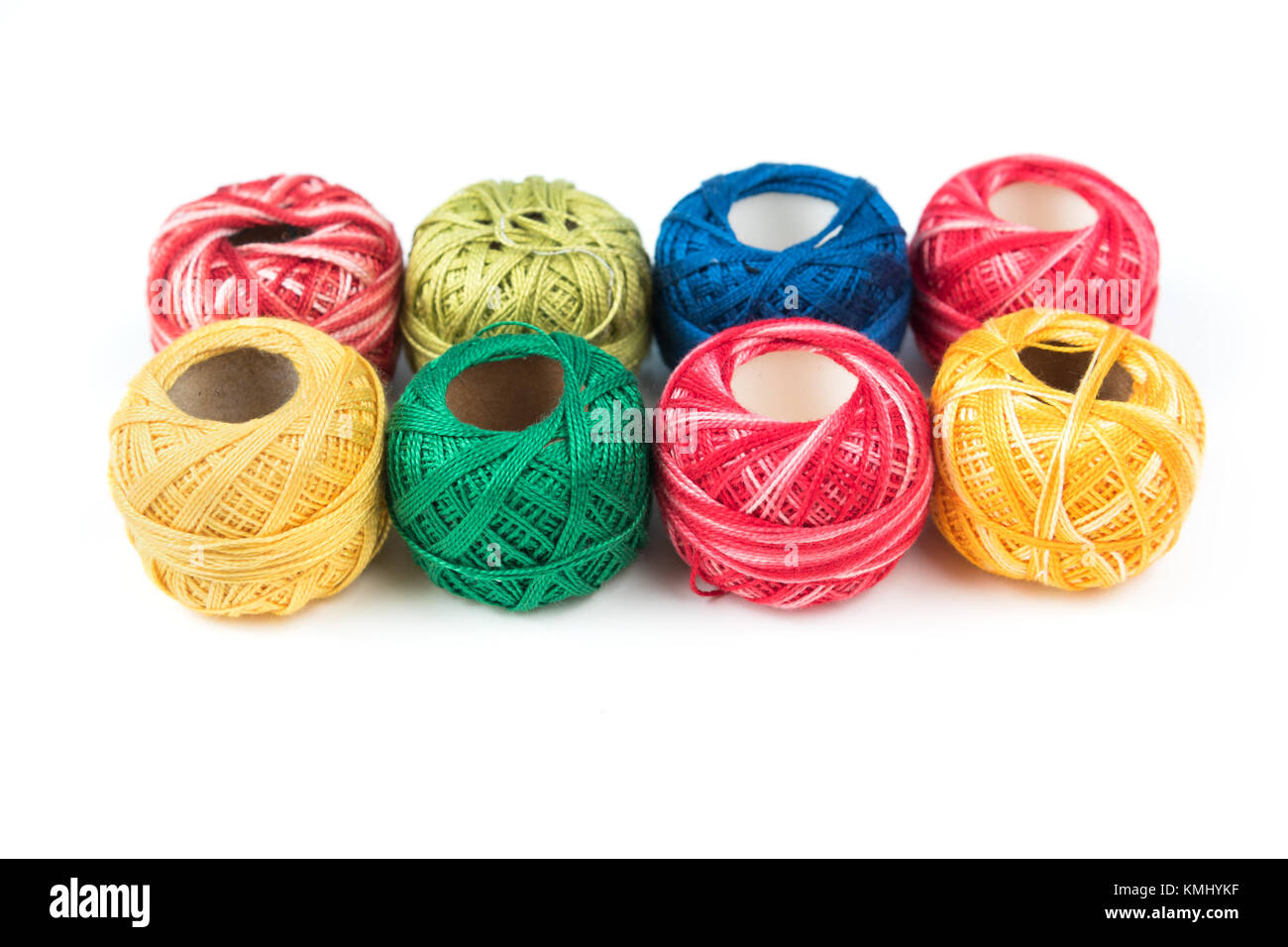 Set of eight colorful sewing threads on a white background Stock Photo ...