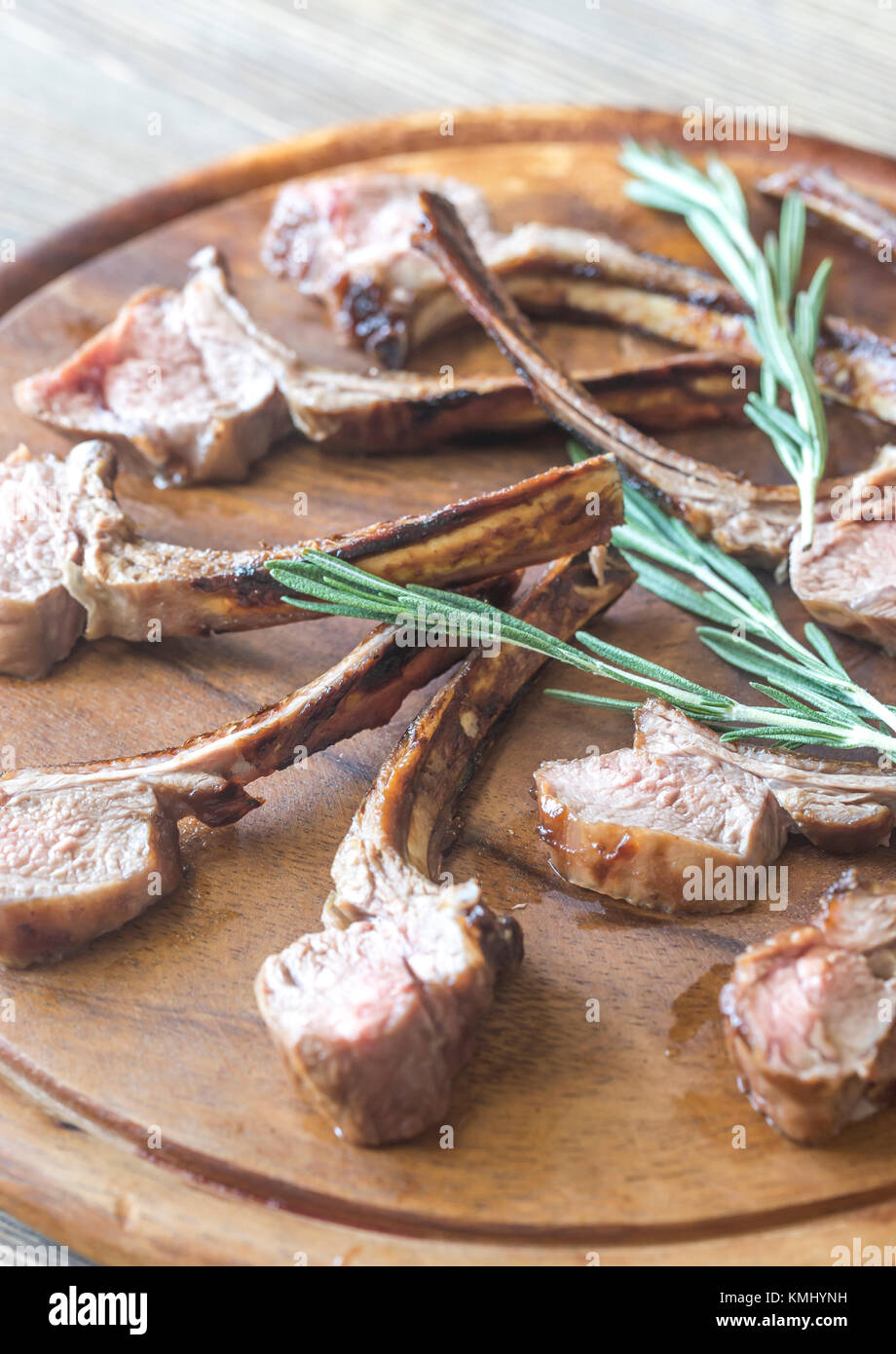 Grilled lamb rib chops on the wooden board Stock Photo - Alamy