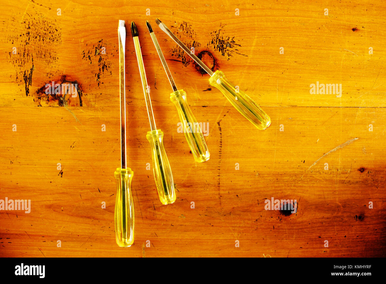 View from above of a yellow screwdrivers set on a wood table Stock ...