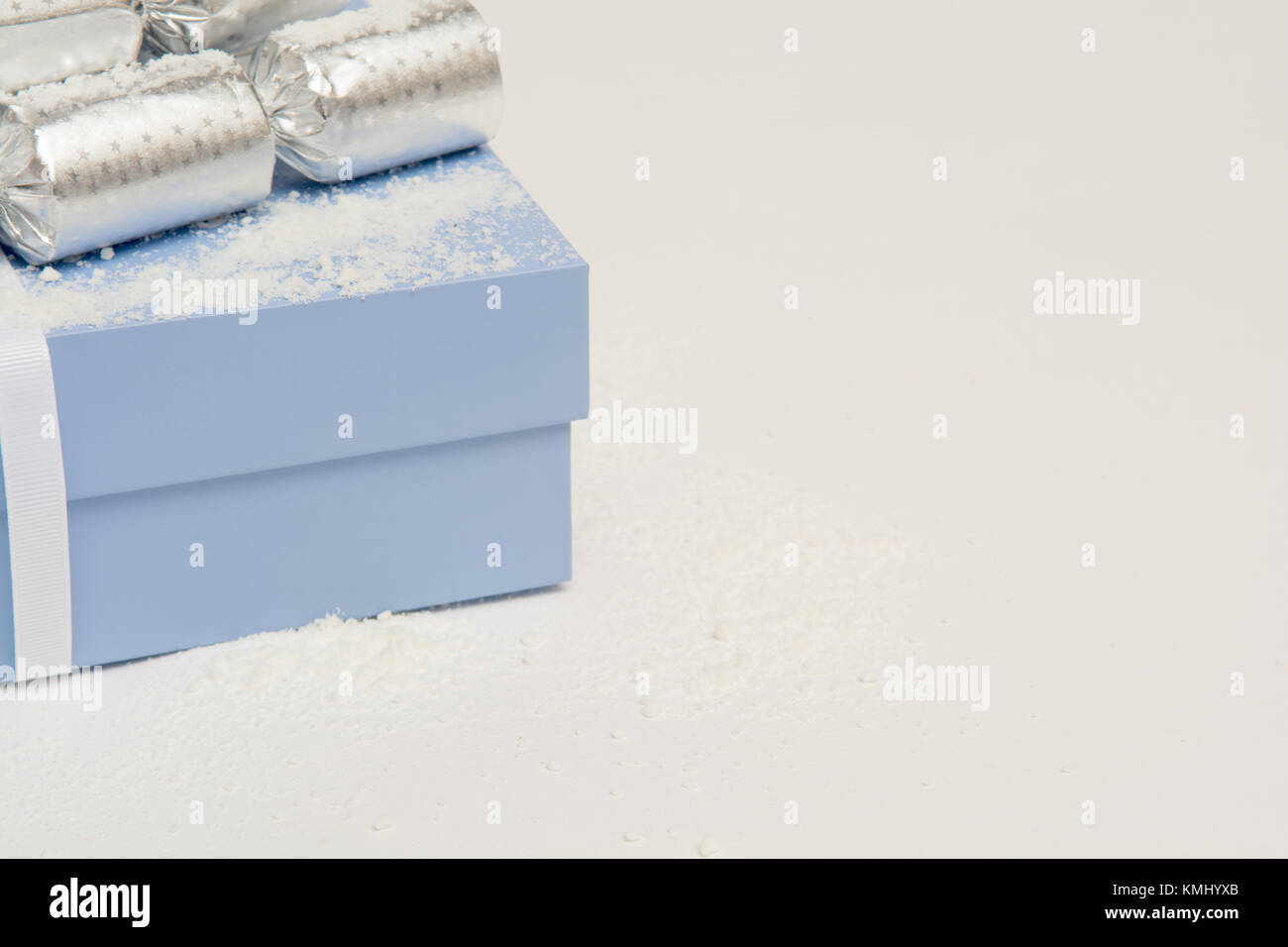 Blue Christmas present in a gift box with snow Stock Photo - Alamy
