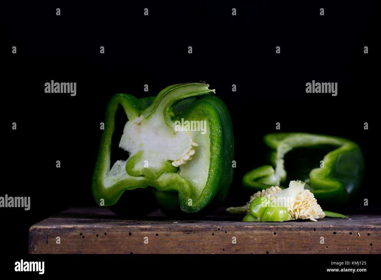 Chopped green paprika on an old kitchen table. Vegetables in the old ...