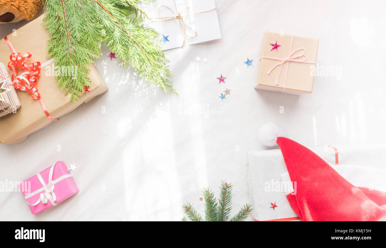 Christmas Presents flat lay with branches concept on white background ...