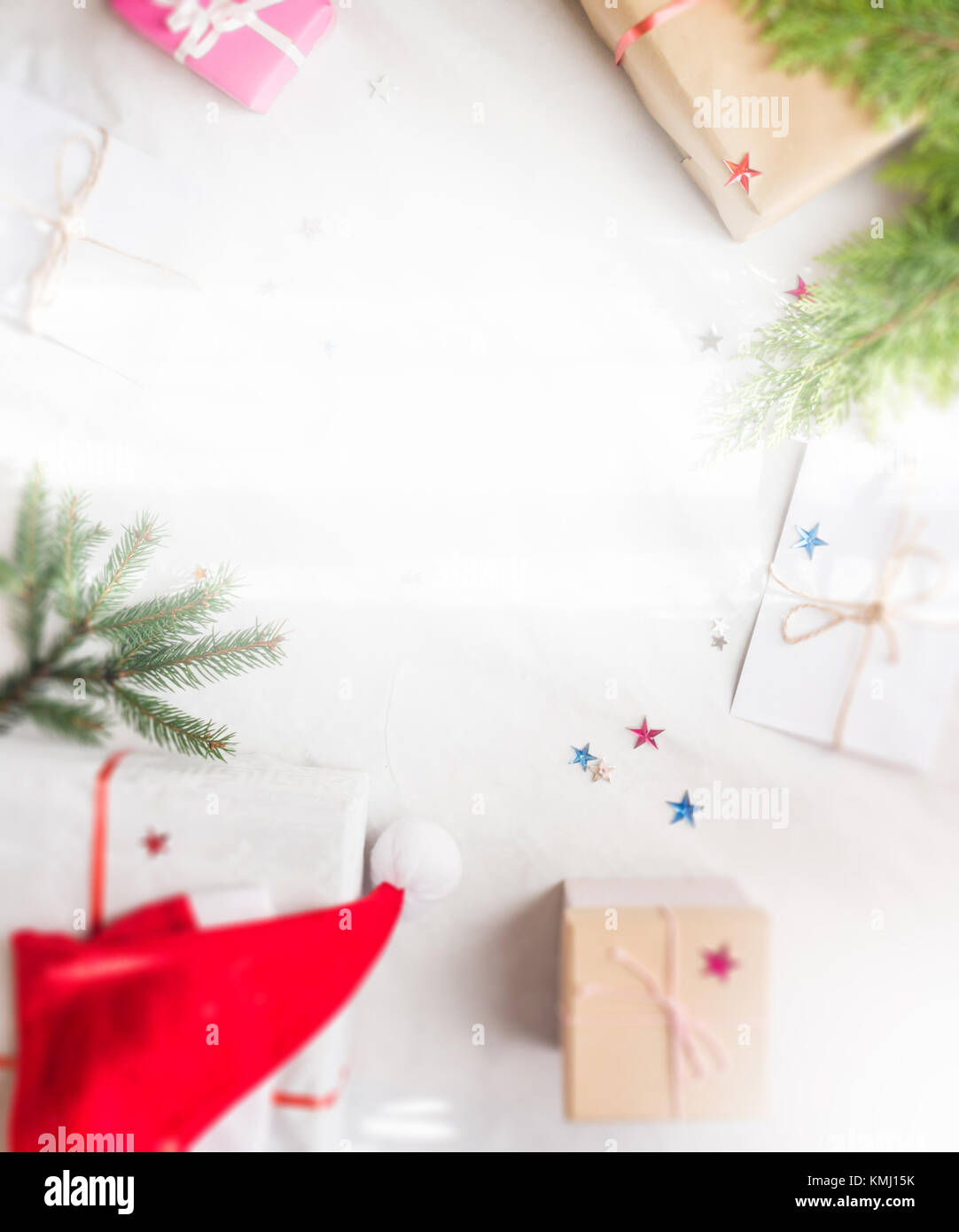 Christmas Presents flat lay with branches concept vertical on white ...