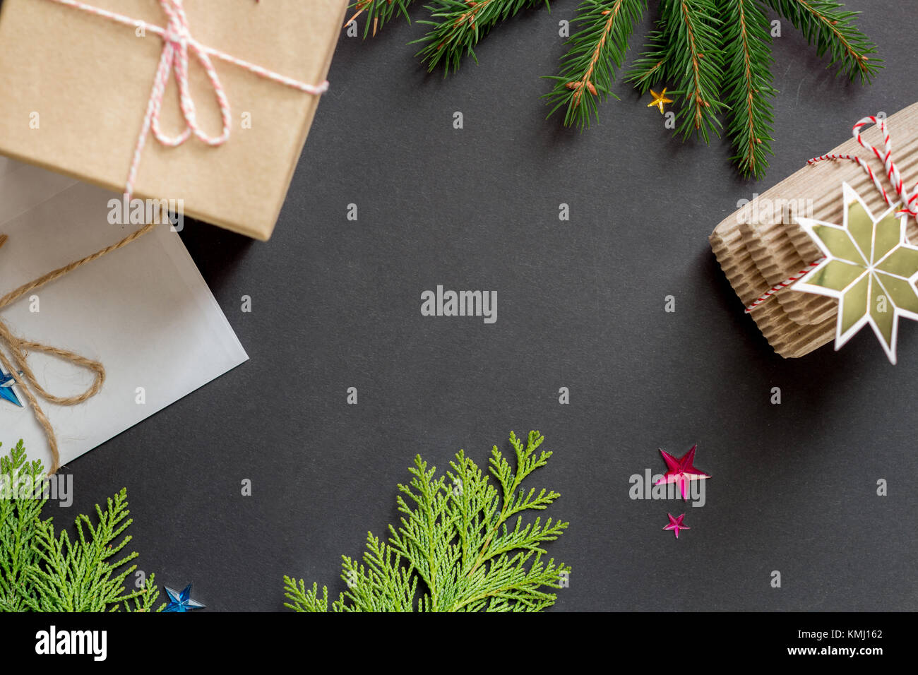 Rustic Christmas Presents and gifts flat lay with branches concept on ...