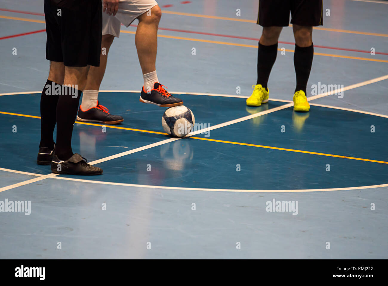 Futsal player with the ball in the sports hall Stock Photo - Alamy