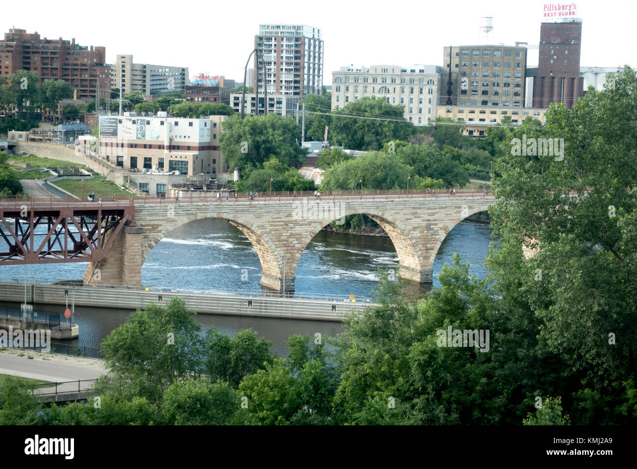 Stone Arch Bridge and the Mississippi River flowing beneath as viewed ...